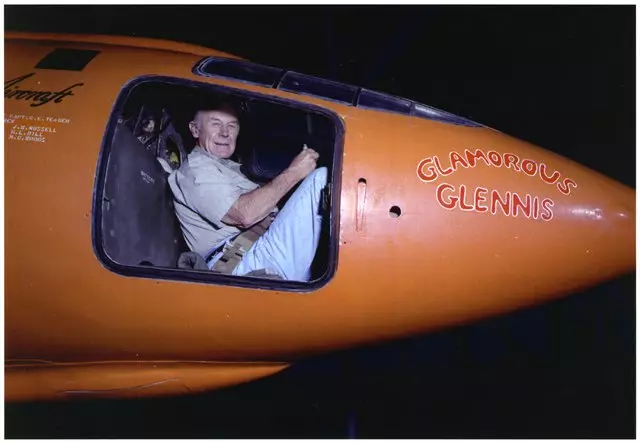 74 year old Chuck Yeager in cockpit of orange Bell X-1