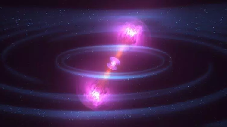 Représentation d'artiste de deux étoiles à neutrons fusionnantes, une autre situation où la fission se produit.