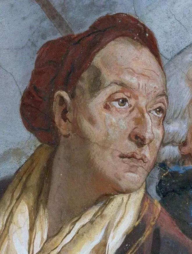 一个男人的脸的壁画片段，戴着一顶红色的帽子，向上看向右