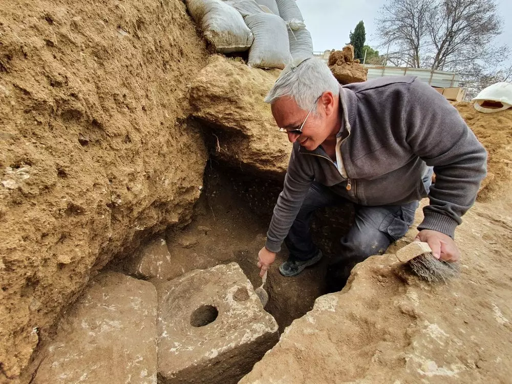 Archaeologists examines the toilet