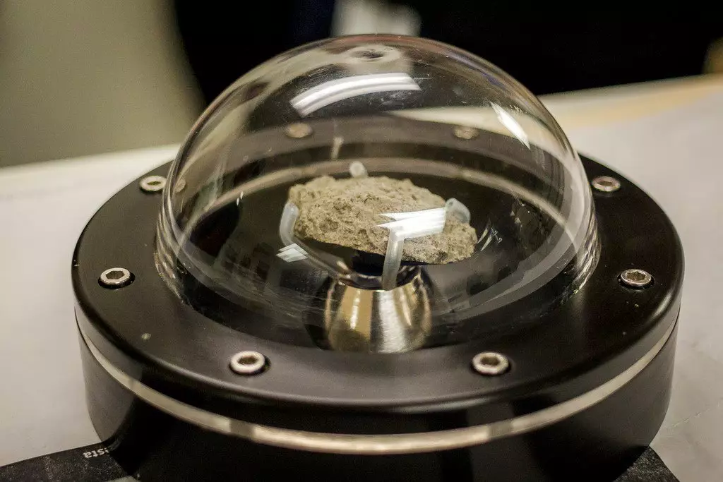 Meteorite in a display case.