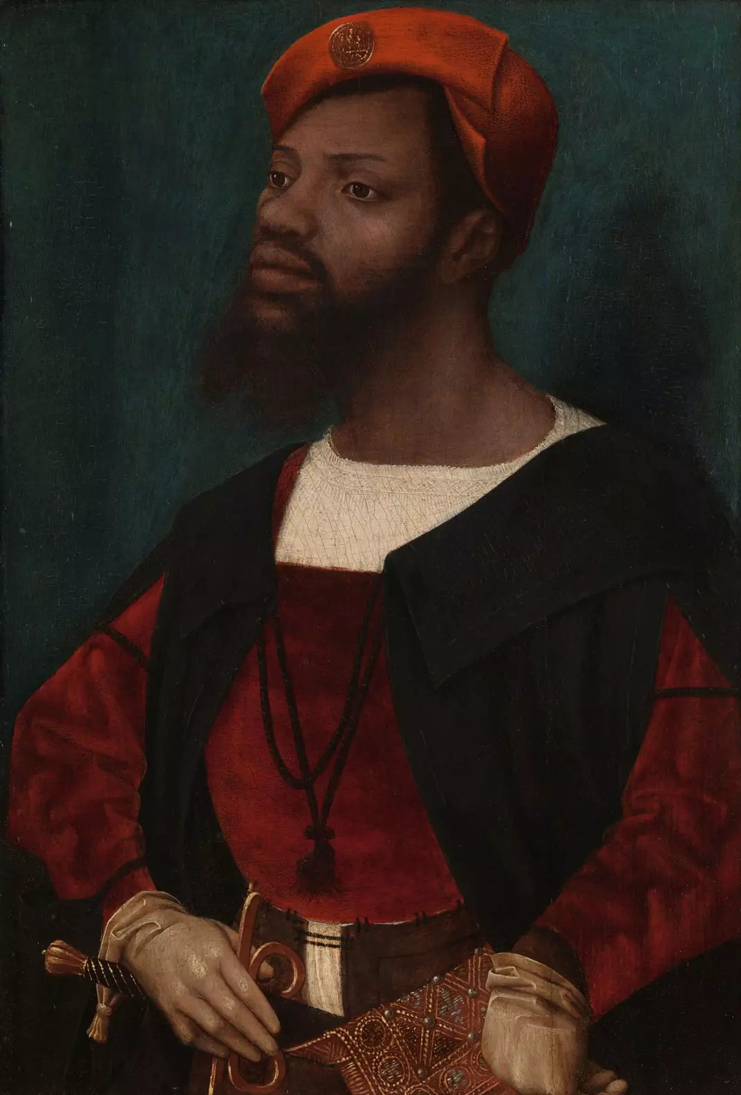 Um retrato de um homem negro com barba, elegante vestido caro e posou com o queixo levantado em uma posição confiante