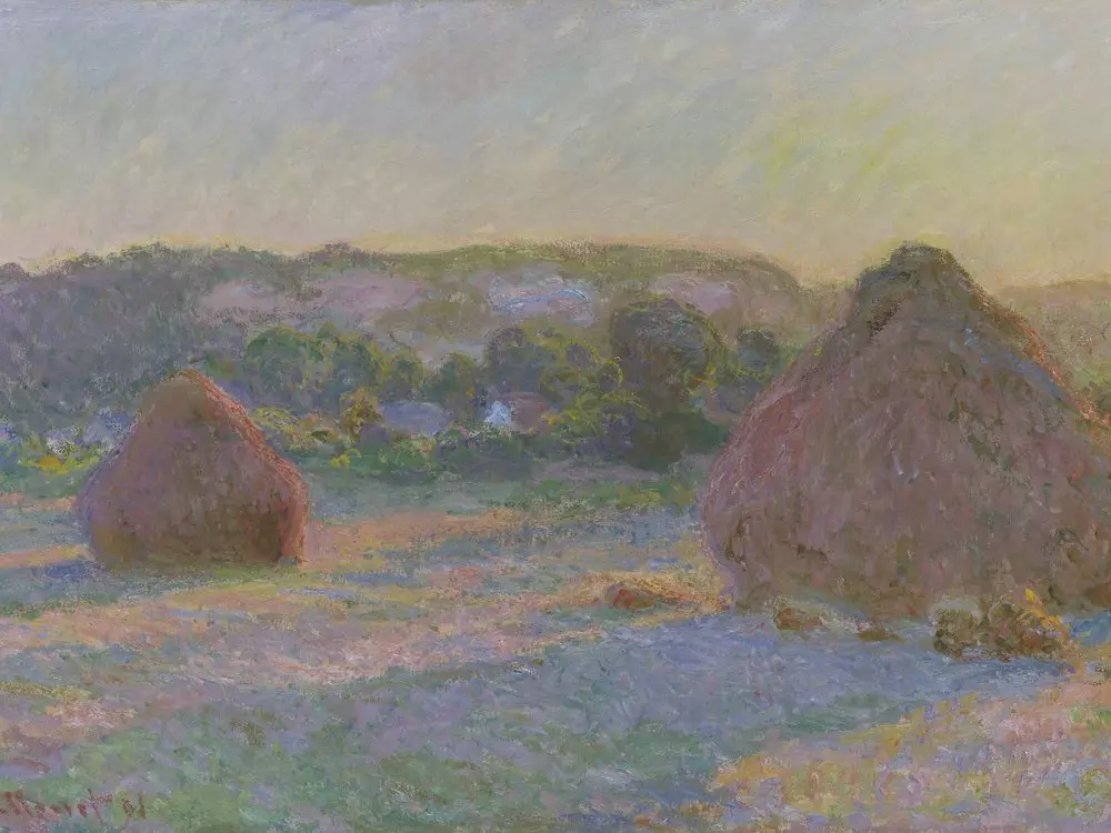 Een roze veld in blauwgeel licht, met links een kleine stapel tarwe en rechts een grotere, rond met een kegelvormige top. Het lijkt avond of ochtend te zijn. De stapels laten lange paarse schaduwen achter en het licht is wazig