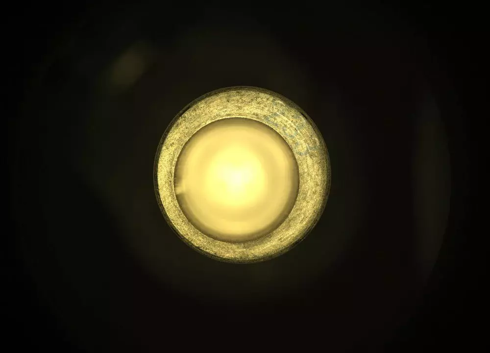 માર્સ રોવરની સેમ્પલ ટ્યુબની અંદરની એક છબી. છબીમાં ટ્યુબ નાના પીળા વર્તુળ જેવી દેખાય છે. ટ્યુબ ખાલી છે.