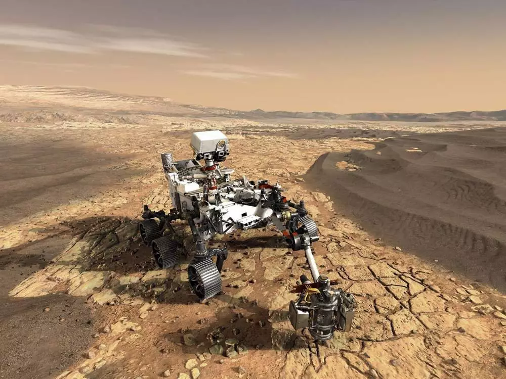 Umetnikova zasnova roverja Perseverance, ki vzorči kamnine na dnu kraterja Jezero. Rover ima tudi helikopter Ingenuity (ni prikazan), ki lahko leti pred roverjem in odkrije visoko prednostne skale in izrastke, da jih rover obišče. (NASA)