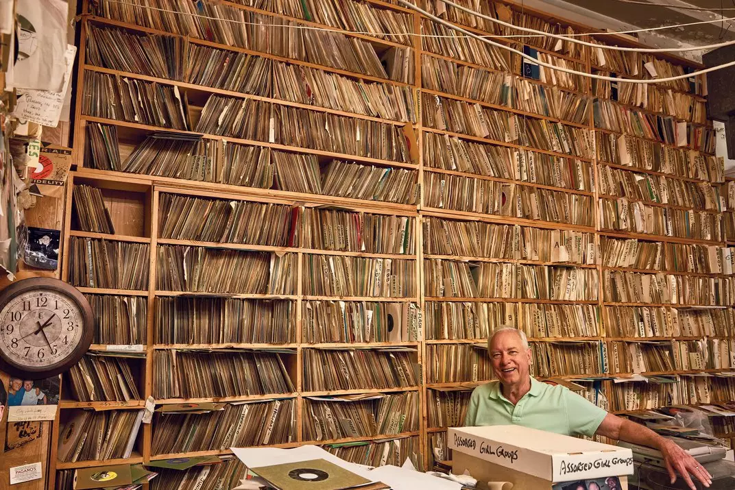 Val Shively in front of large shelf