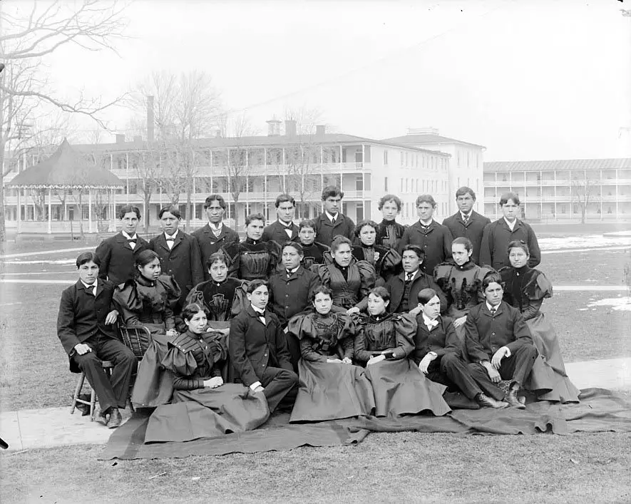 Group_of_Mame_and_Female_Students;_Brick_Dormitories_And_Bandstand_in_Background_1879.jpg