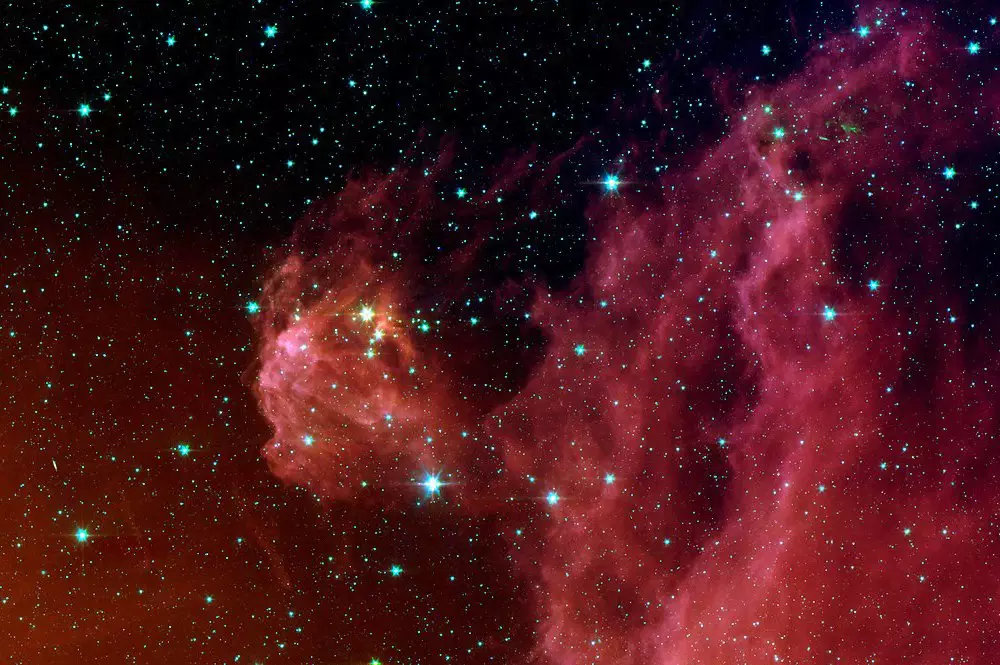 नासाच्या स्पिट्झर स्पेस टेलिस्कोपने इन्फ्रारेडमध्ये छायाचित्रित केल्याप्रमाणे ओरियन नक्षत्रातील तारा निर्मिती