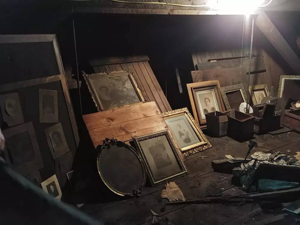 Frames and photographs found in the secret attic studio