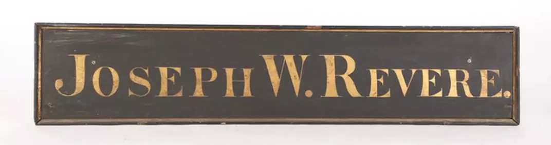 Un rètol comercial amb lletra de fulla d'or que porta el nom de Joseph W. Revere